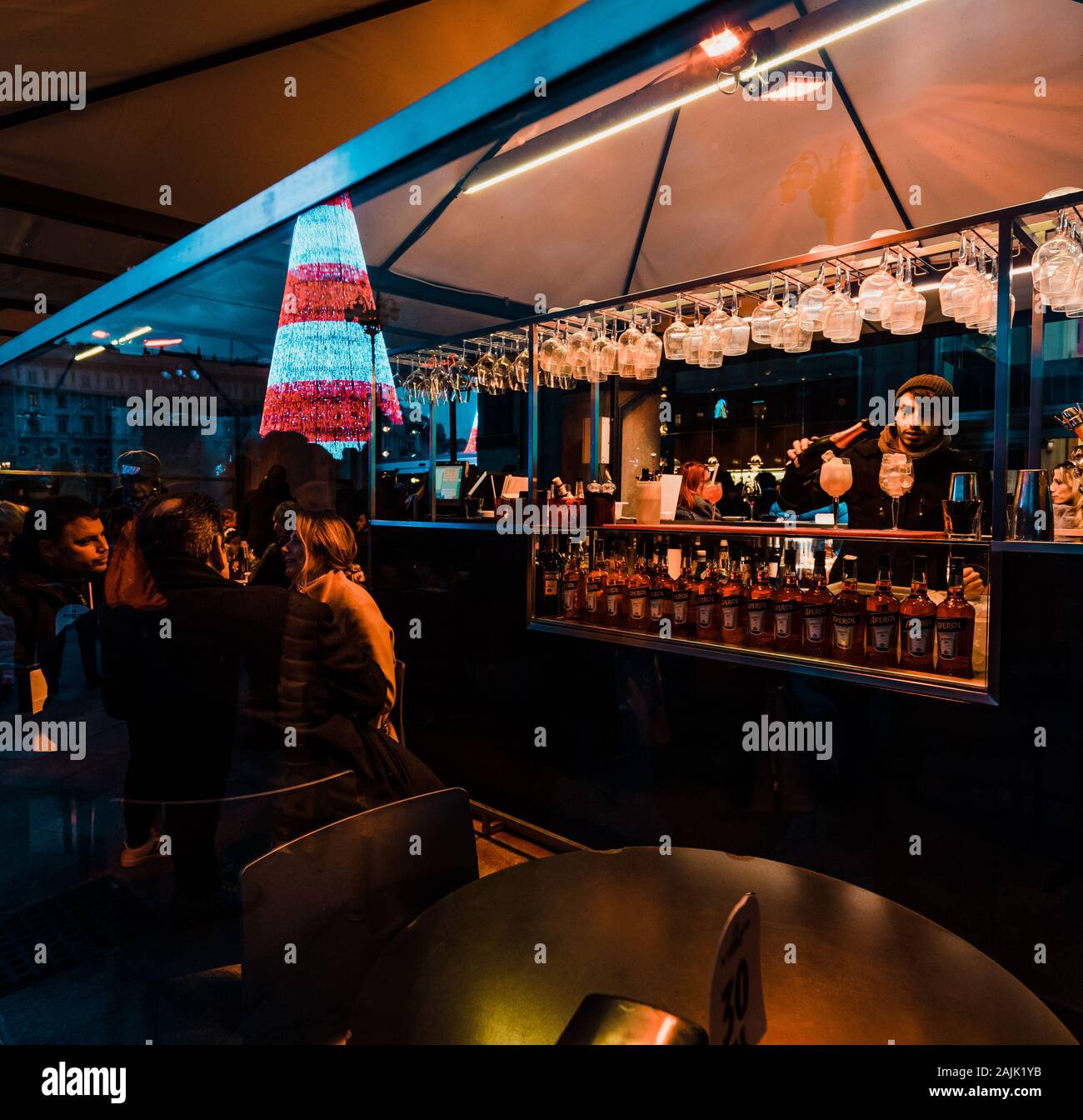 Small Bar in Duomo Square, Milan city, the Barman And a group of ...