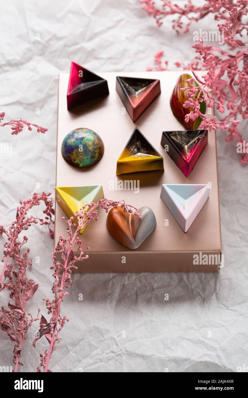 Chocolate candy collections and flowers Stock Photo - Alamy
