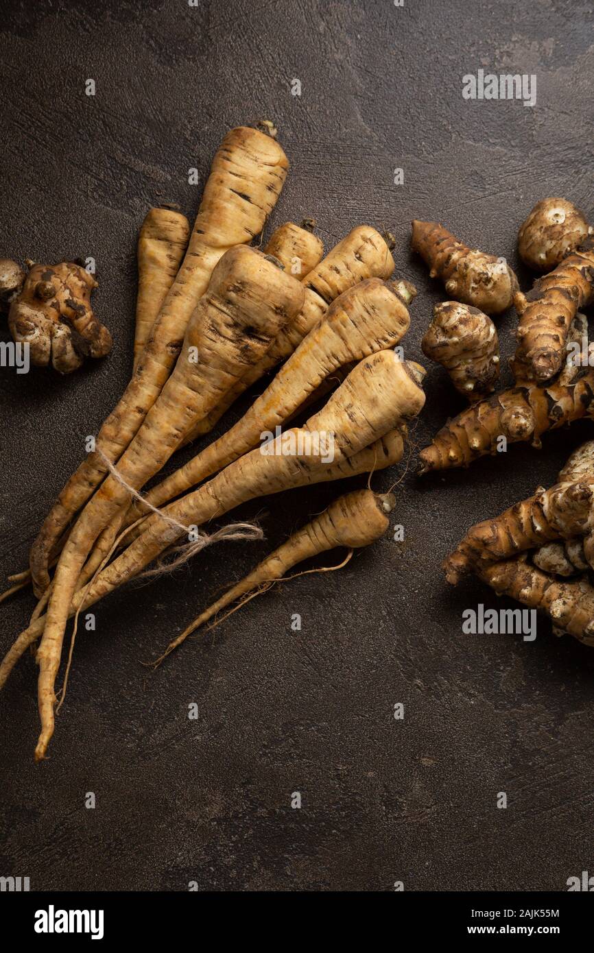 Fresh local winter roots top view, parsnip Stock Photo - Alamy