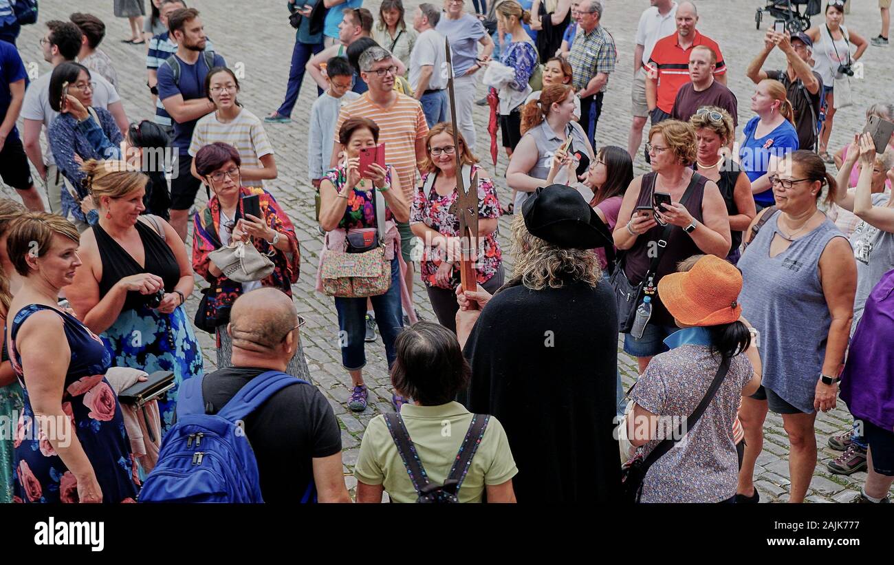 The famous Night Watchman dressed in medieval outfit addresses a group ...