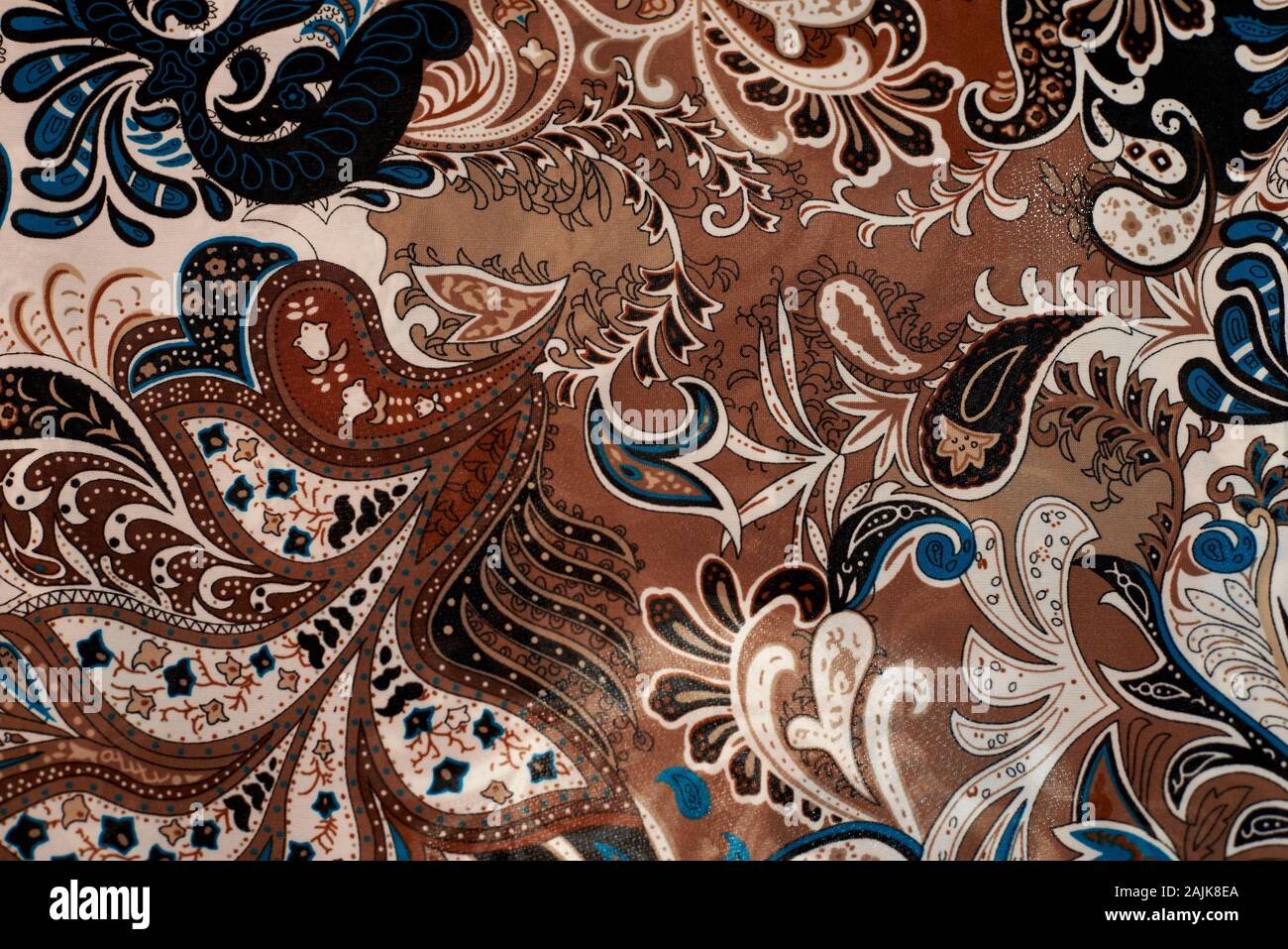 Indian brown paisley patterns on cloth Stock Photo - Alamy