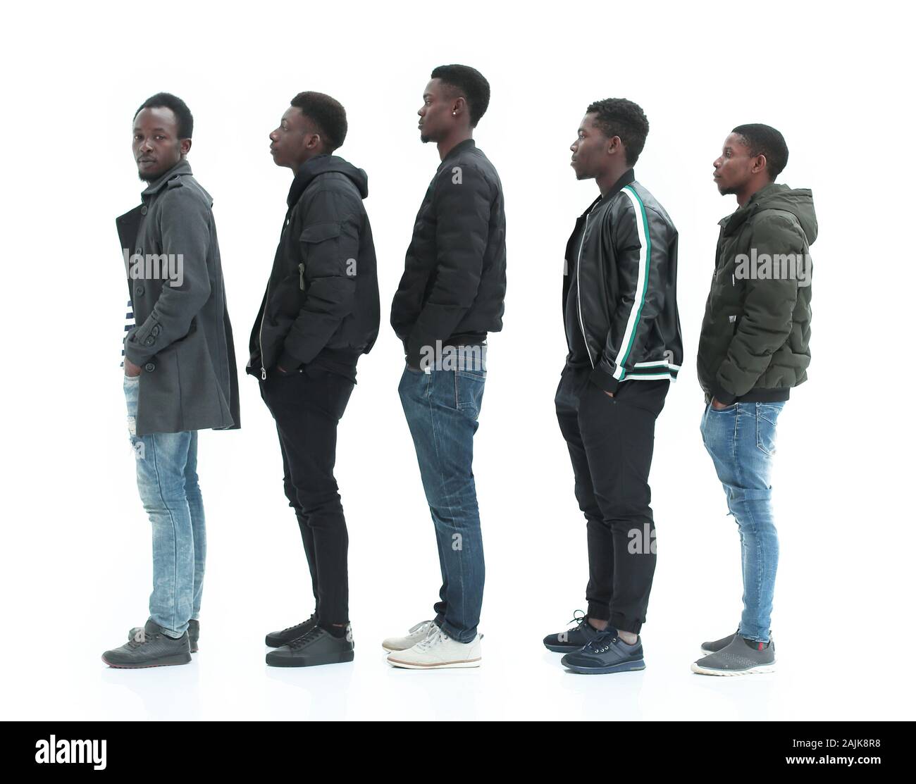 group of diverse guys standing in turns . isolated on white Stock Photo ...