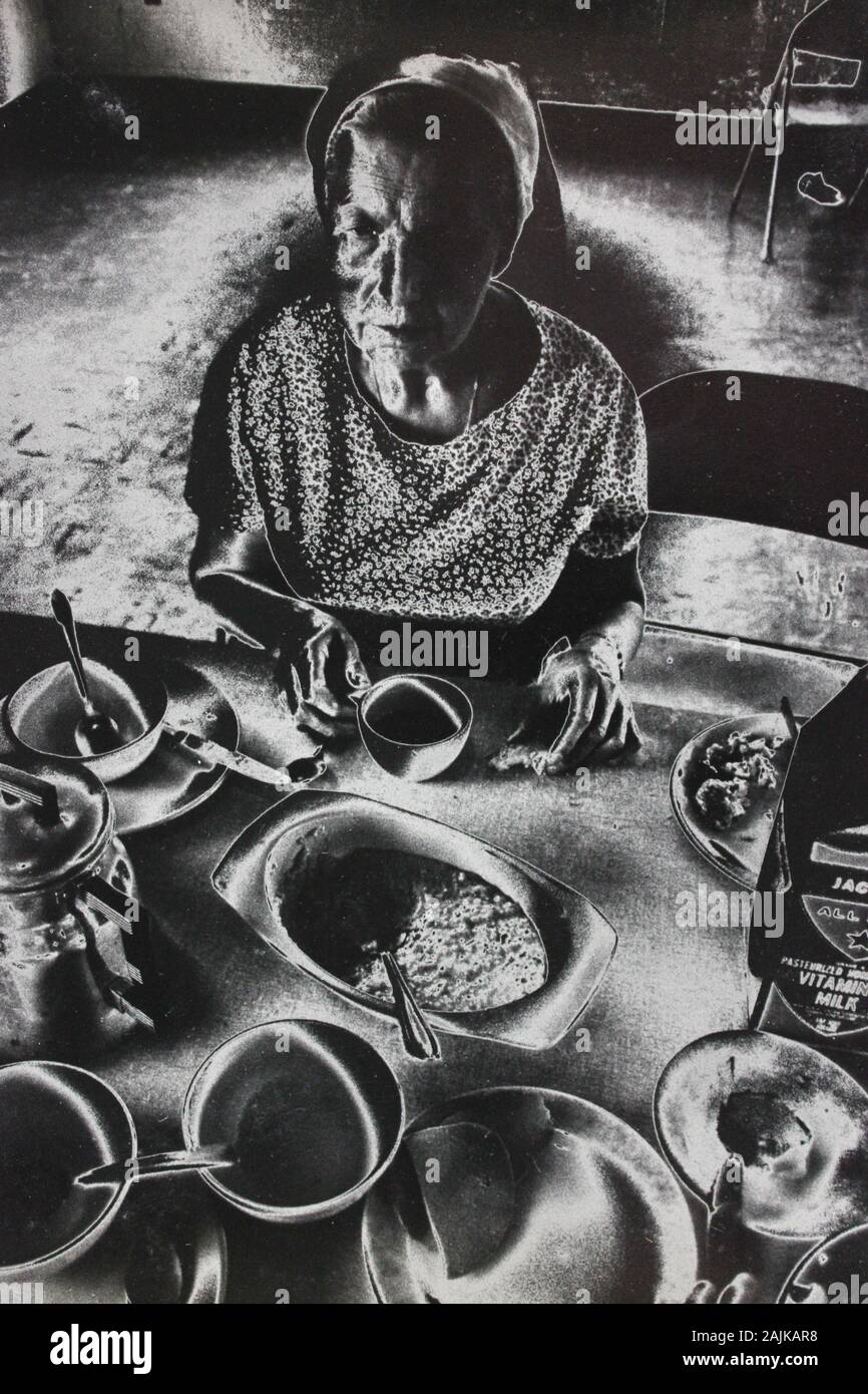 Fine 1970s vintage photography of a lonely old woman sitting at her ...