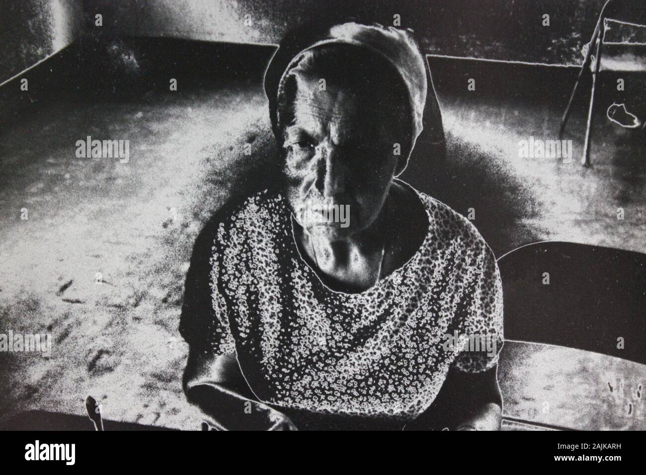 Fine 1970s vintage photography of a lonely old woman sitting at her ...