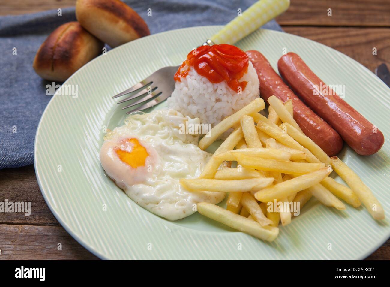 american breakfast with egg and sausage and rice Stock Photo - Alamy