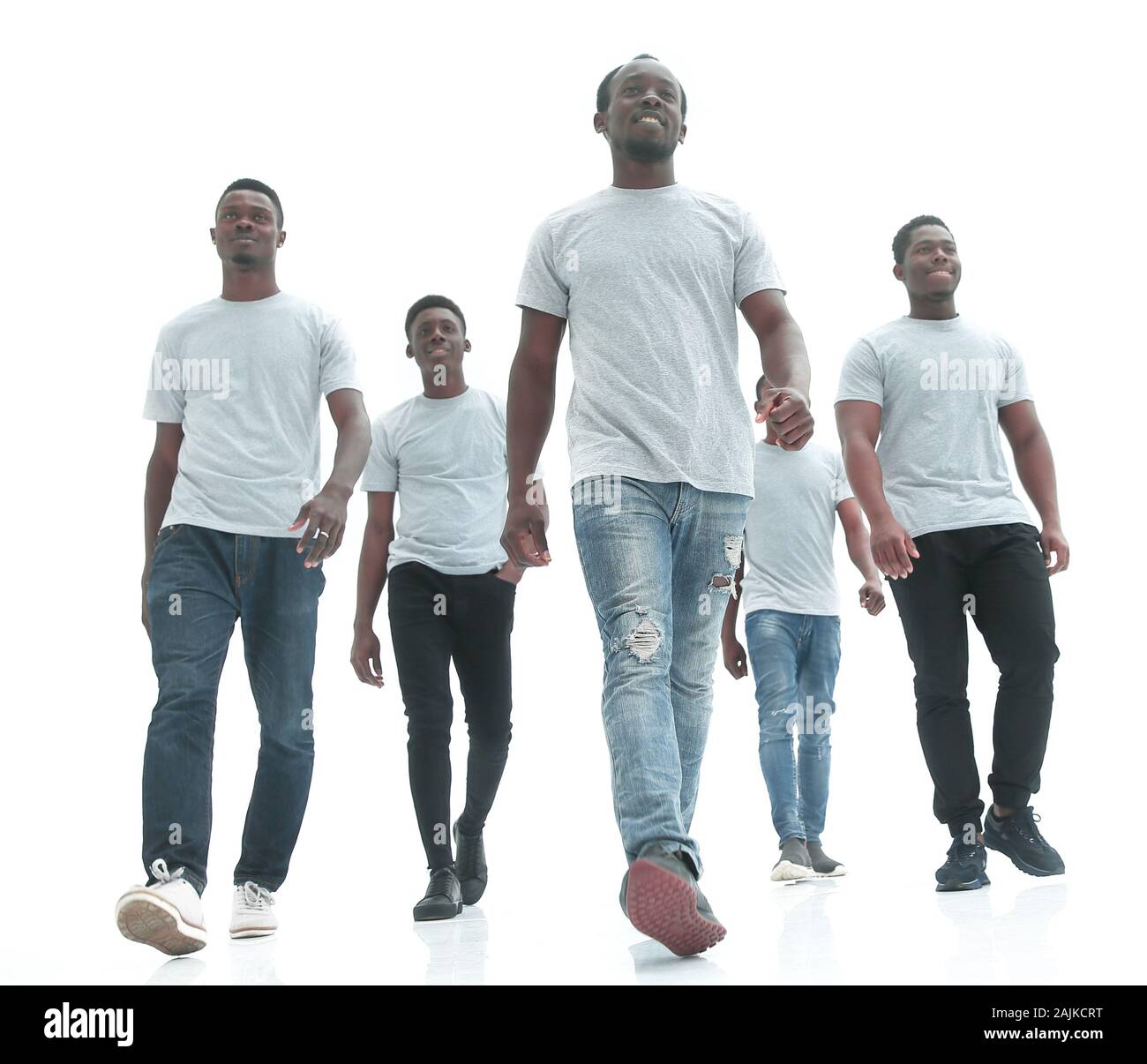 in full growth. team of young people stepping forward Stock Photo - Alamy