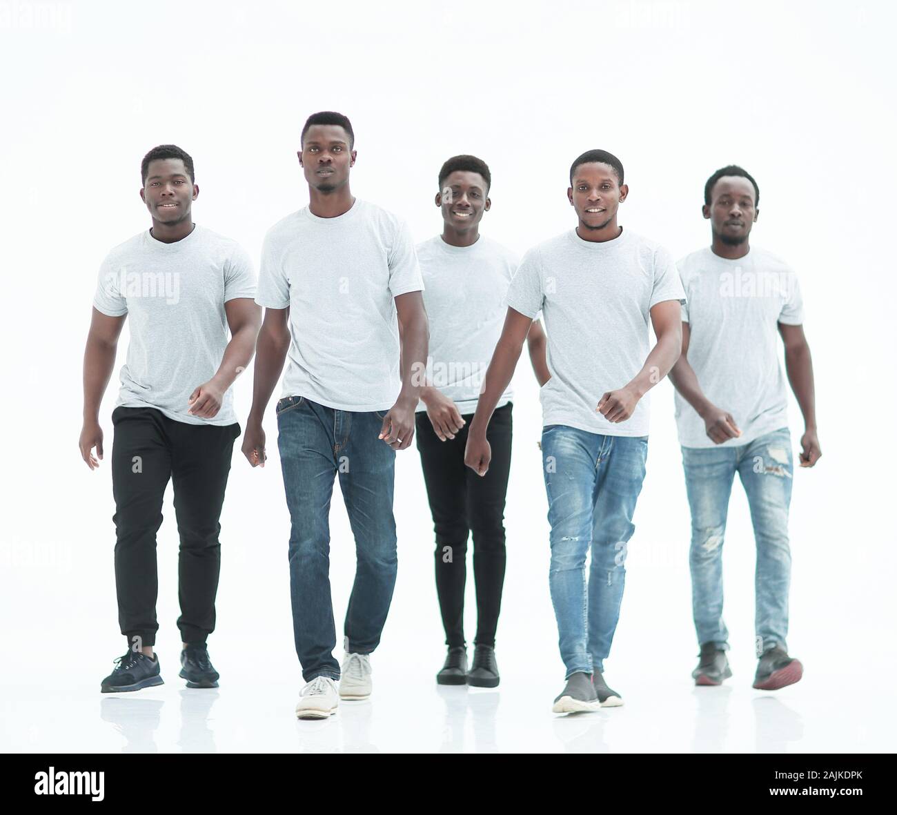 in full growth. a team of confident modern guys standing together Stock ...