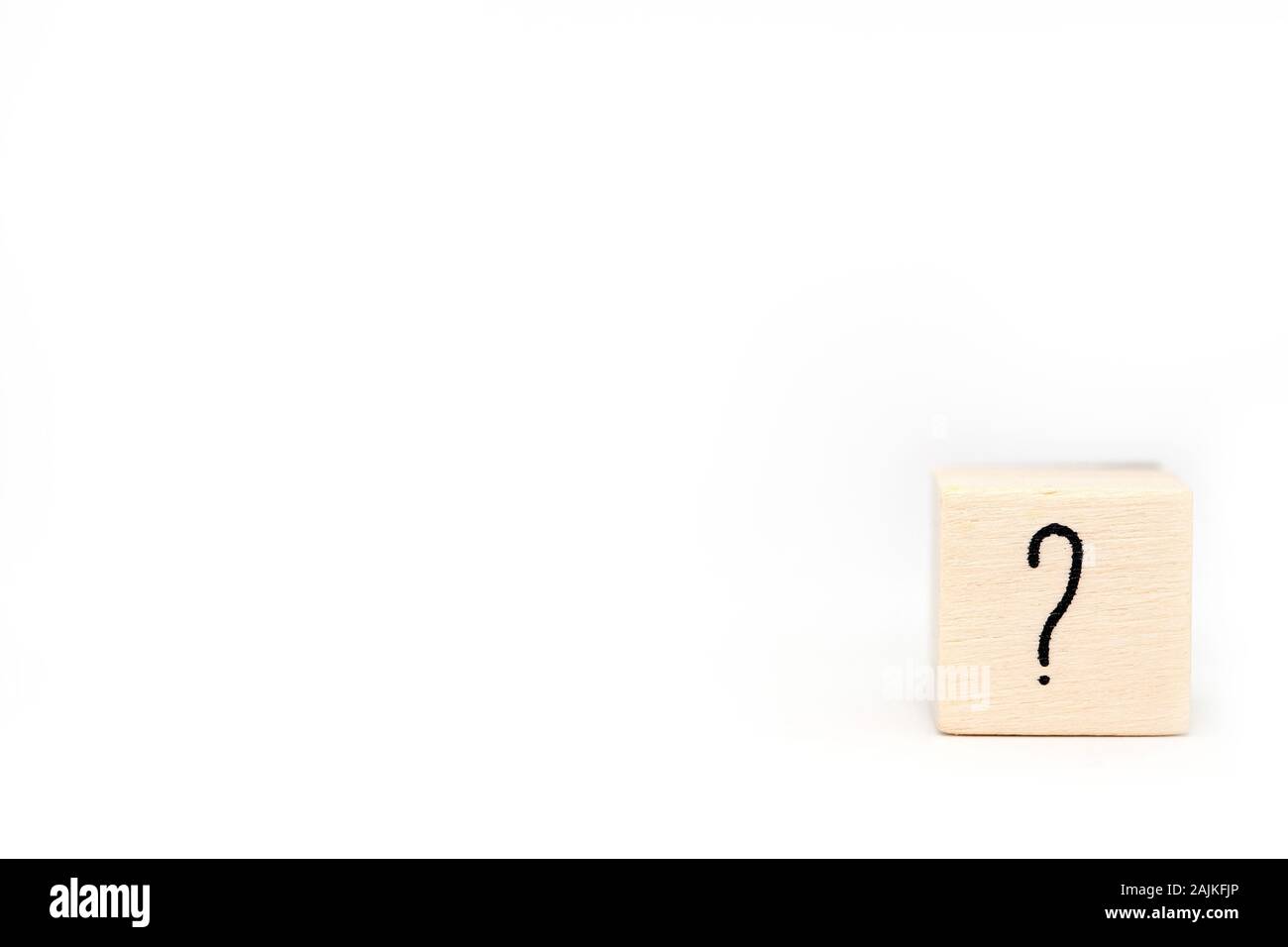 question mark on wood cube isolated on white background, symbol space ...