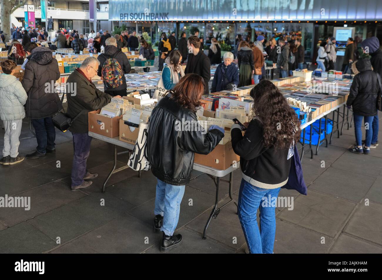 People browse at the Southbank Centre outdoor weekend book market ...
