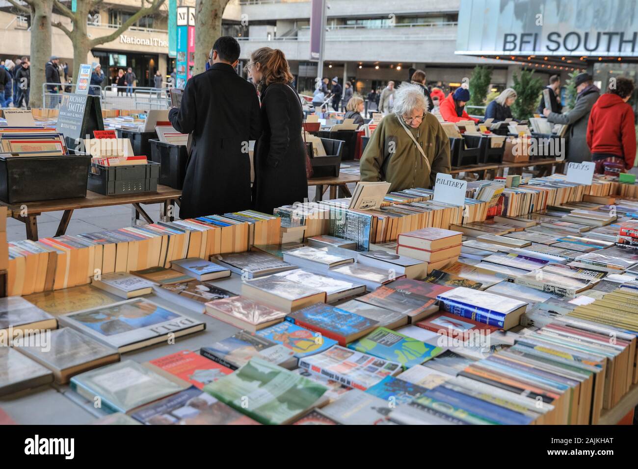 People browse at the Southbank Centre outdoor weekend book market ...