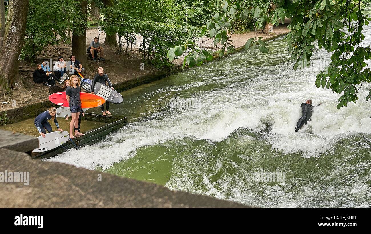 Unique activity of River Surfing in downtown Munich at the Eisbach ...