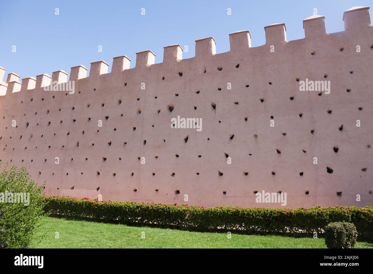Rammed earth city walls of Marrakesh with many holes which are ...