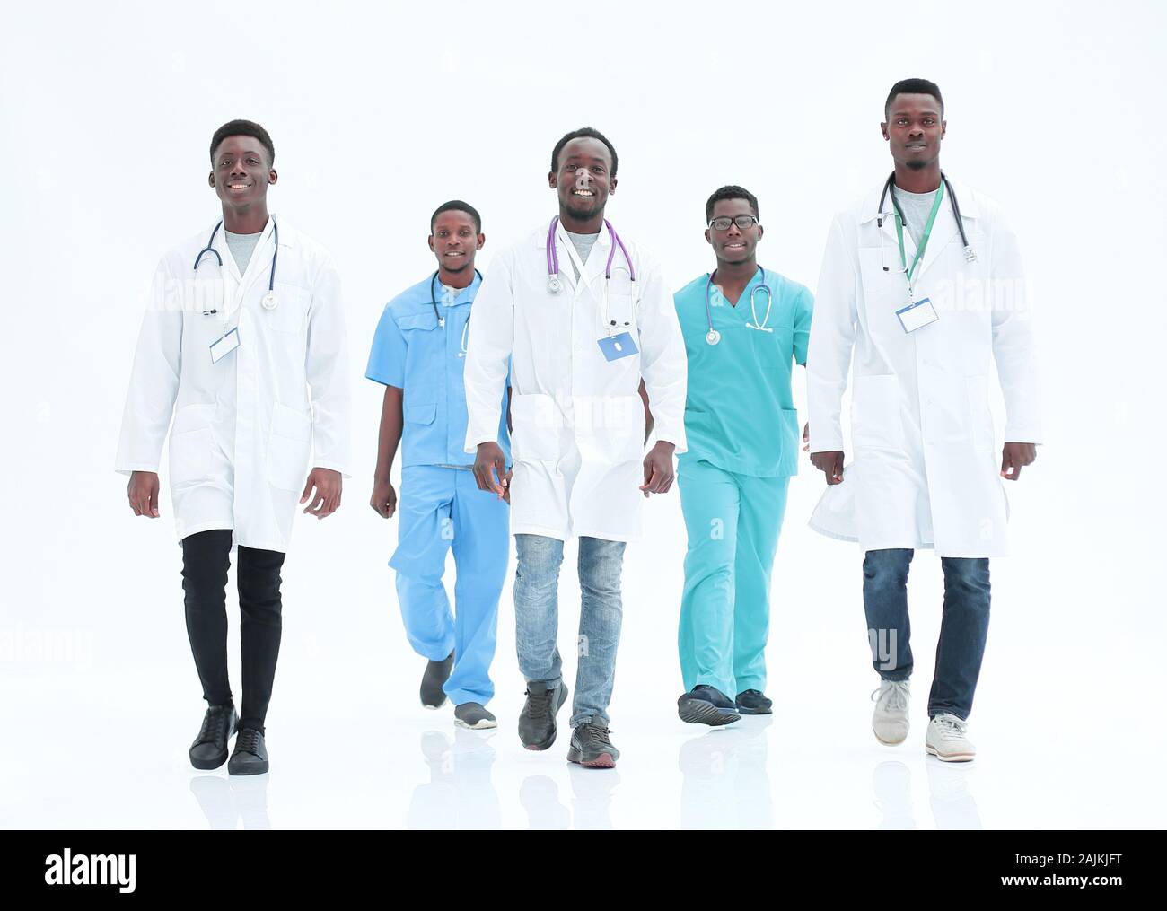 group of different doctors rush to the rescue. isolated on white Stock ...