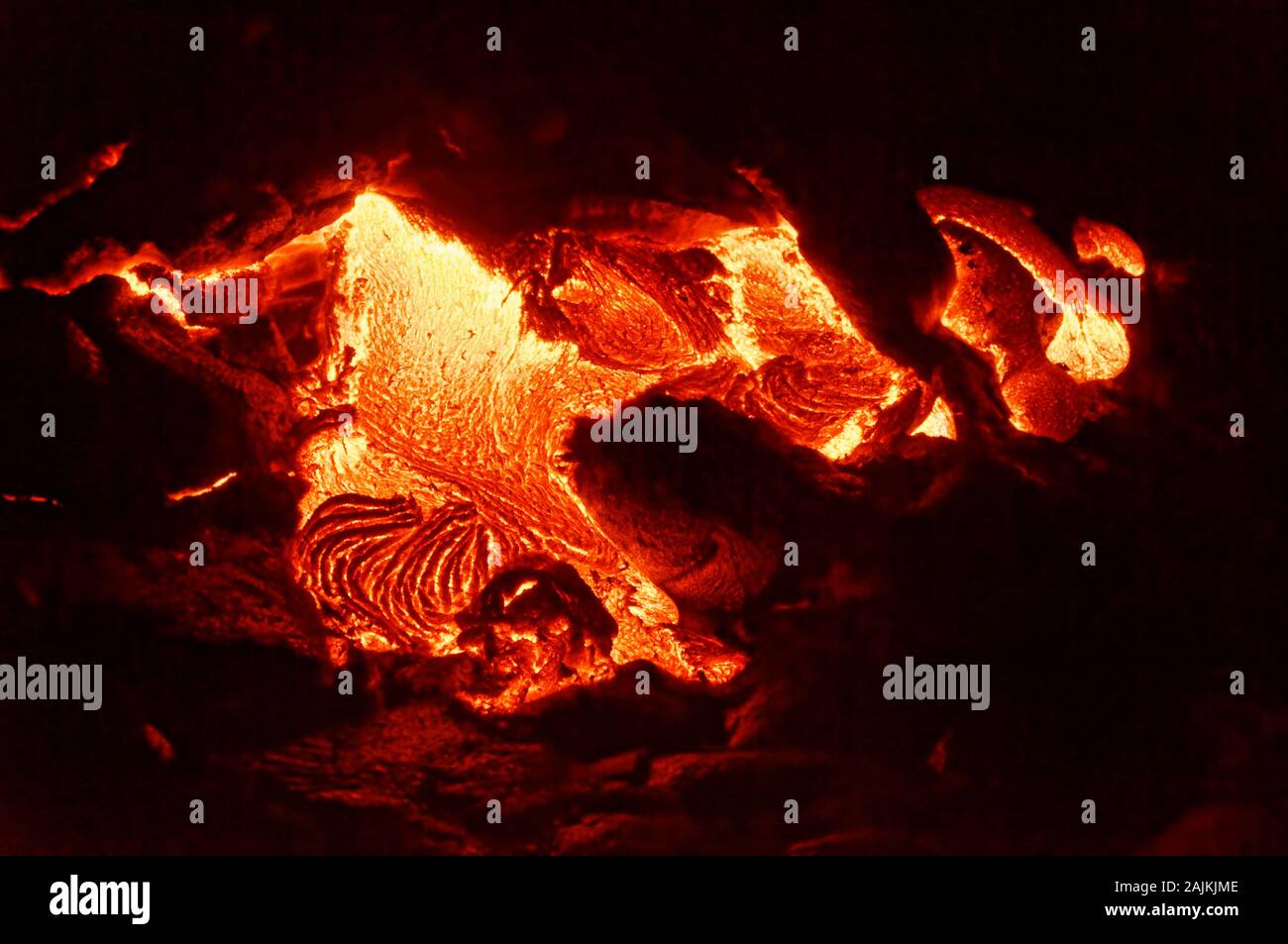 Detailed view of an active lava flow, hot magma emerges from a crack in ...