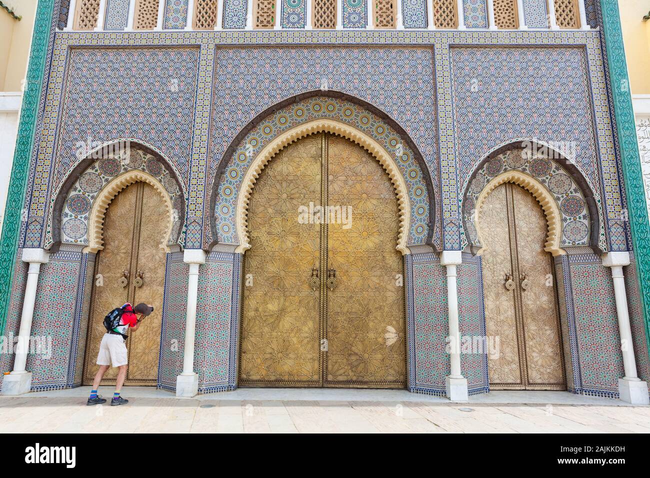 A man photographing the entrance to Dar al-Makhzen (also known as ...