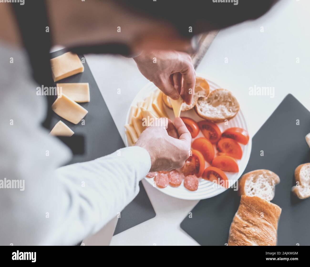 close up. man making sandwiches in the kitchen Stock Photo - Alamy