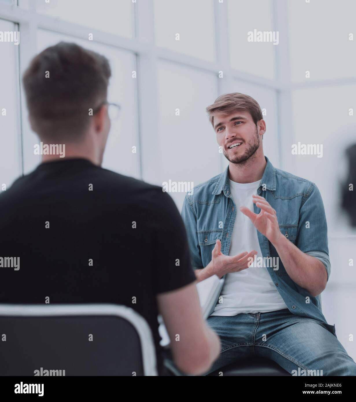 two young men talking in the TV Studio Stock Photo - Alamy