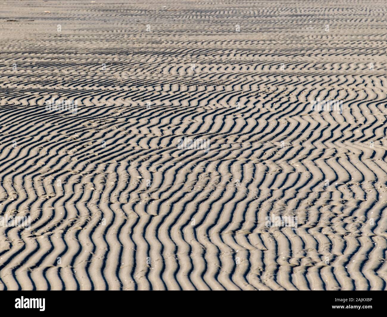 abstract texture with sand texture, sea water and sand formations on ...