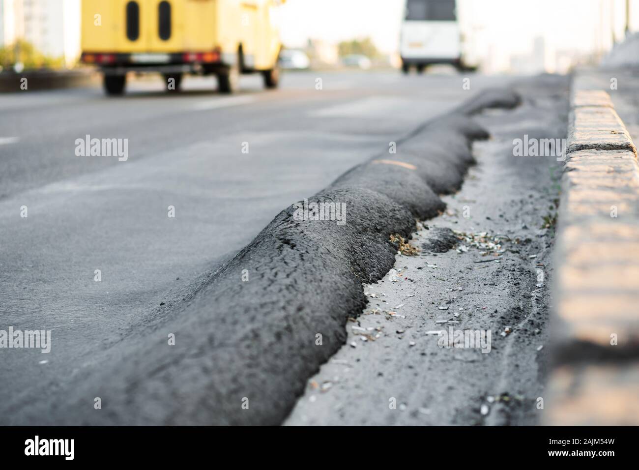Floating substandard asphalt. Poor quality road Stock Photo - Alamy
