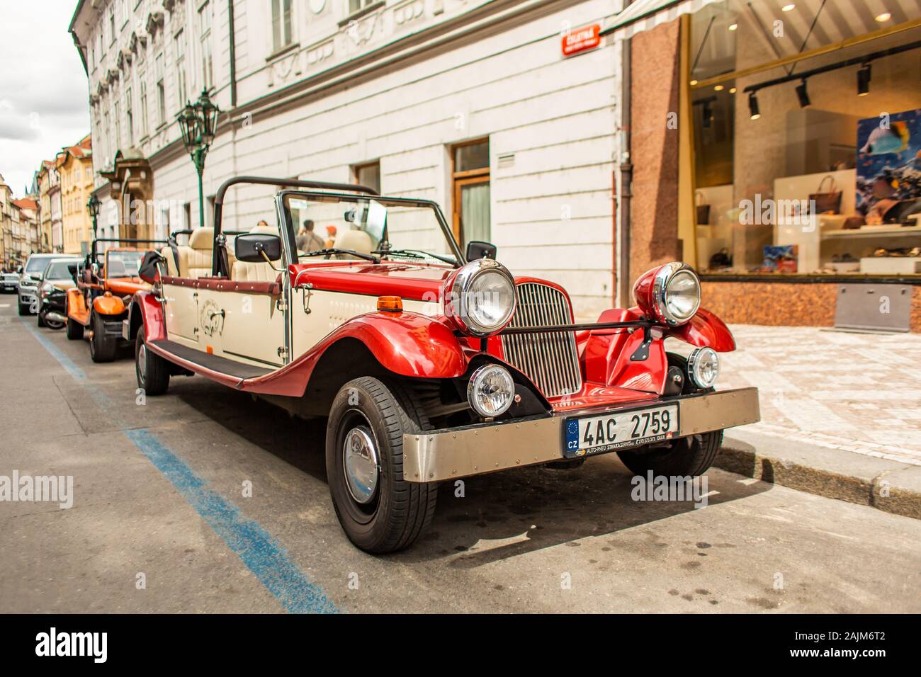 Old retro convertible car parked on the street of the old town Stock ...