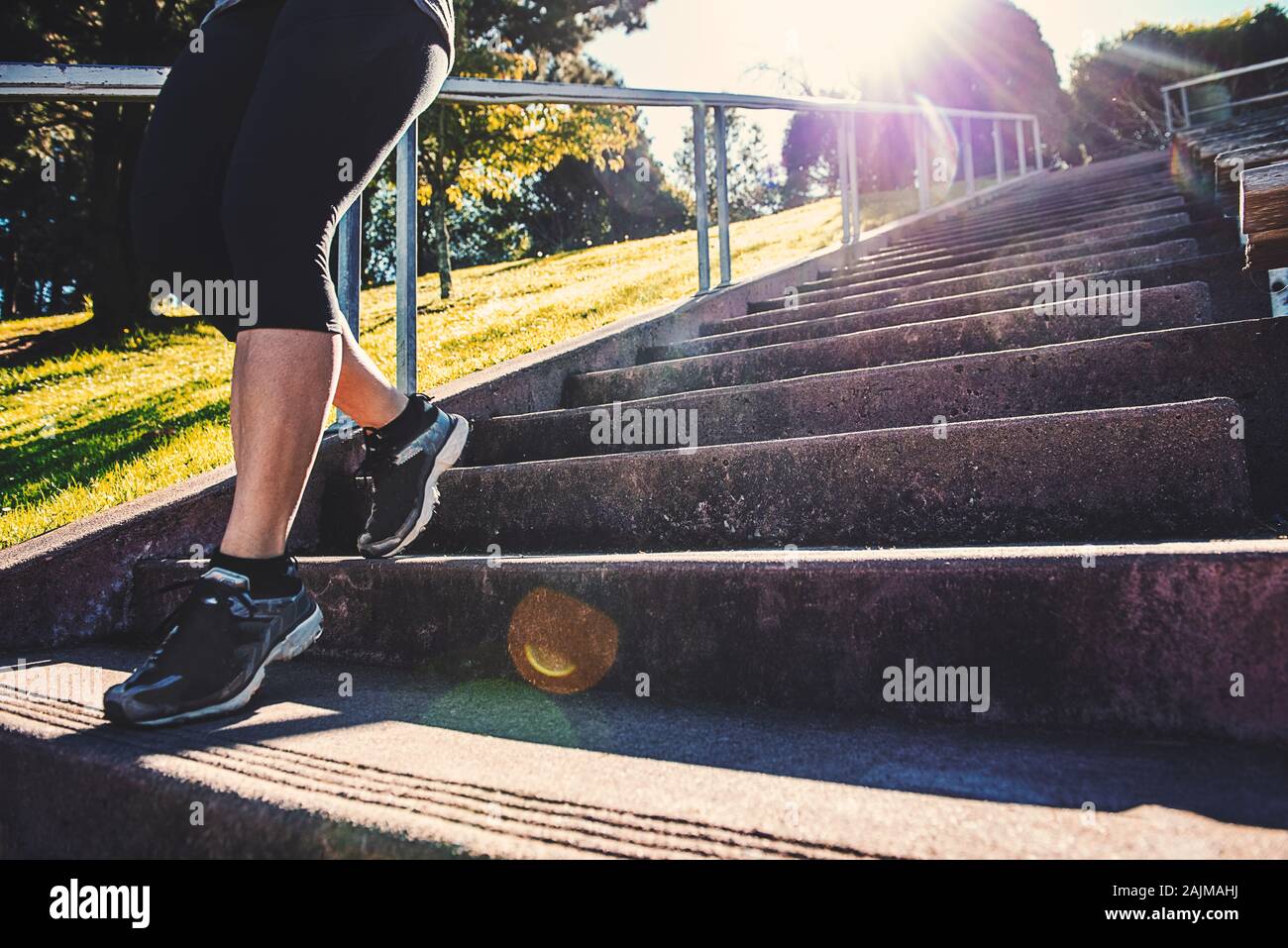 woman running down steps in California Stock Photo - Alamy