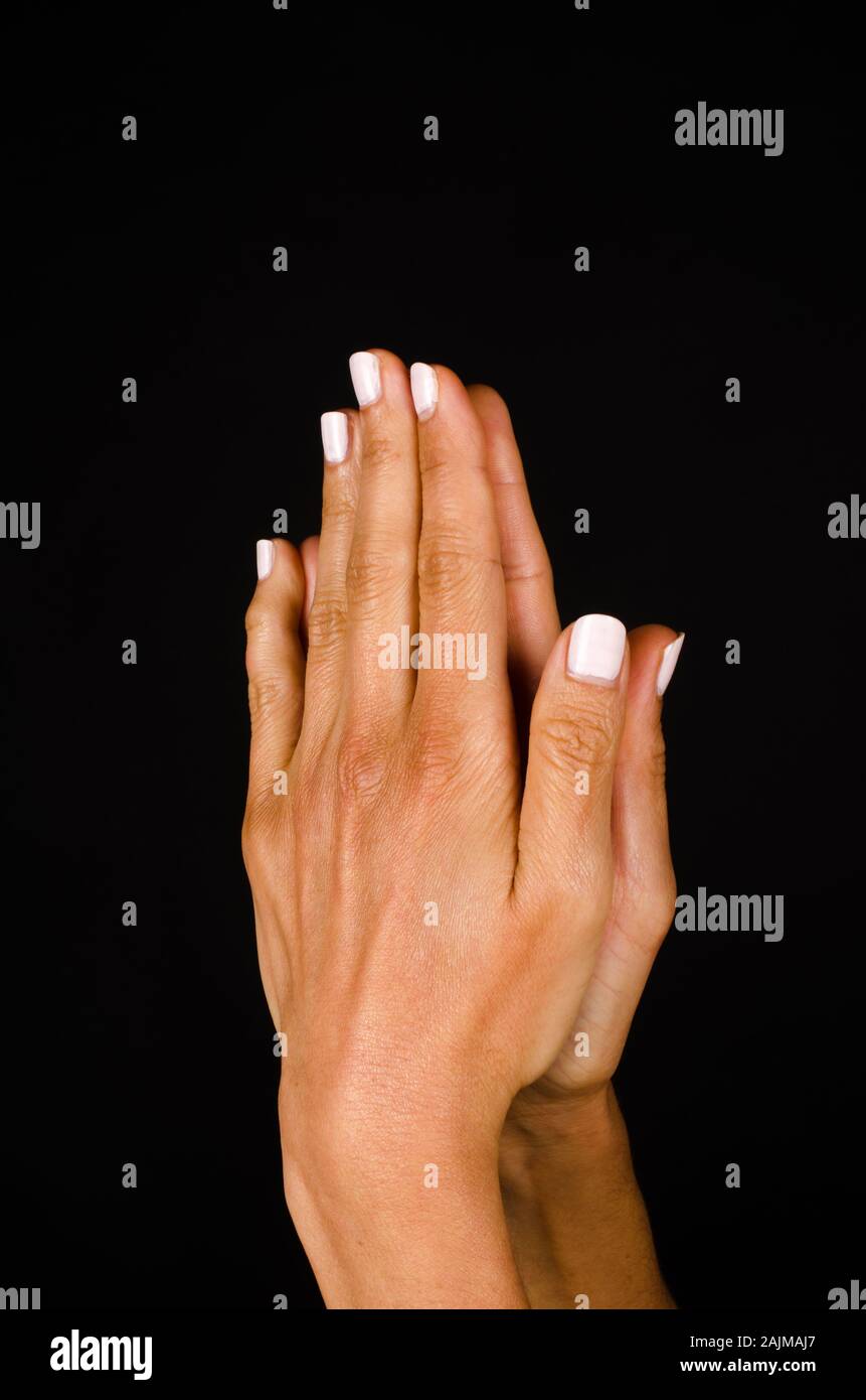 Female hands in praying gesture Stock Photo - Alamy