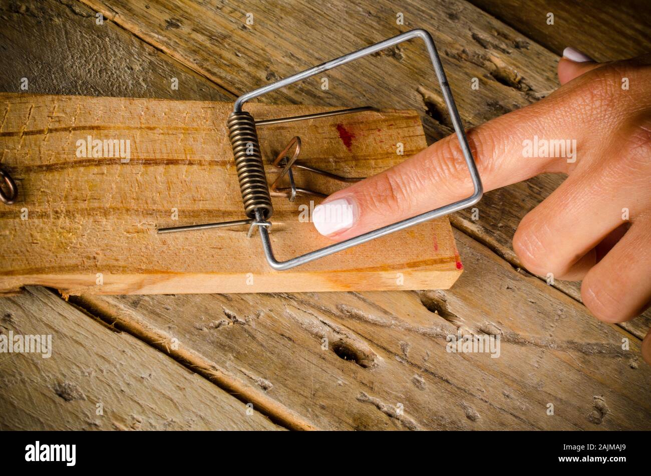 Hands in a mouse trap Stock Photo - Alamy