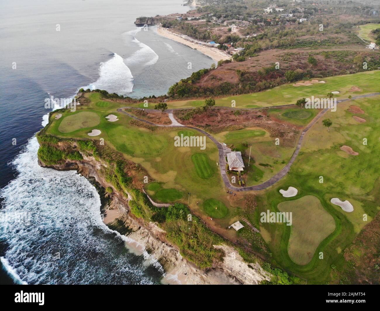 Aerial view of luxury golf field next the cliff, ocean and beach in ...