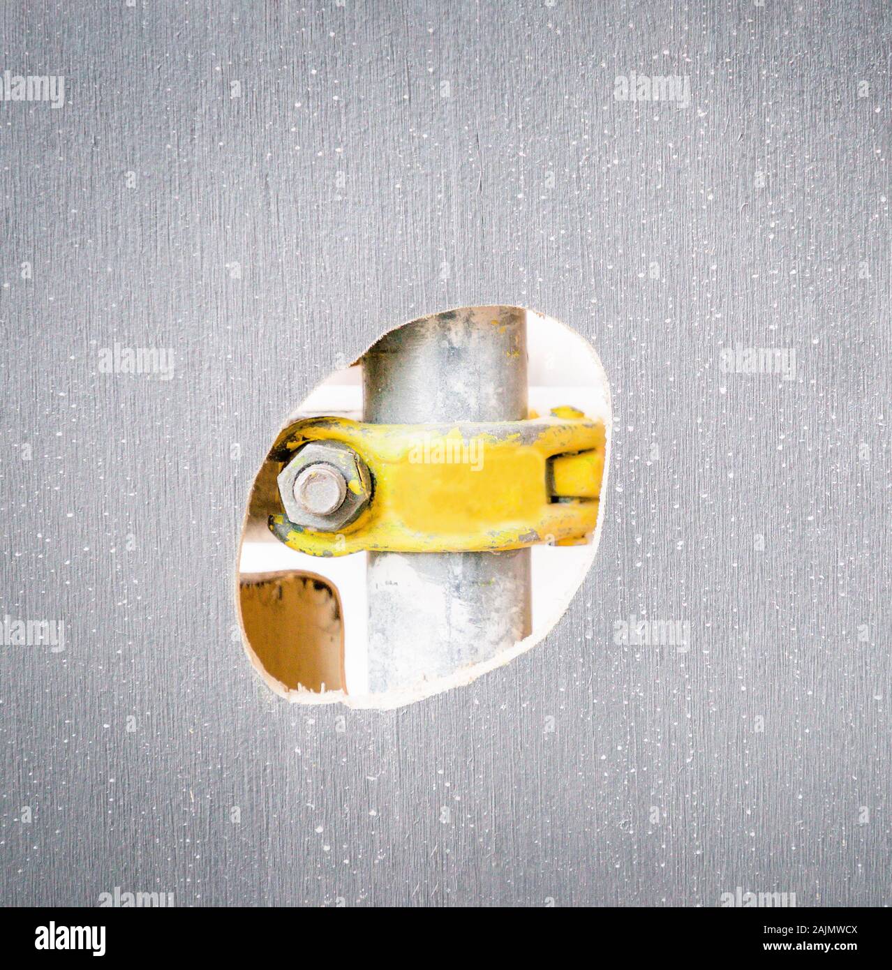 Gray wall background. Part of pipe with nut. Scaffolding, detail Stock ...