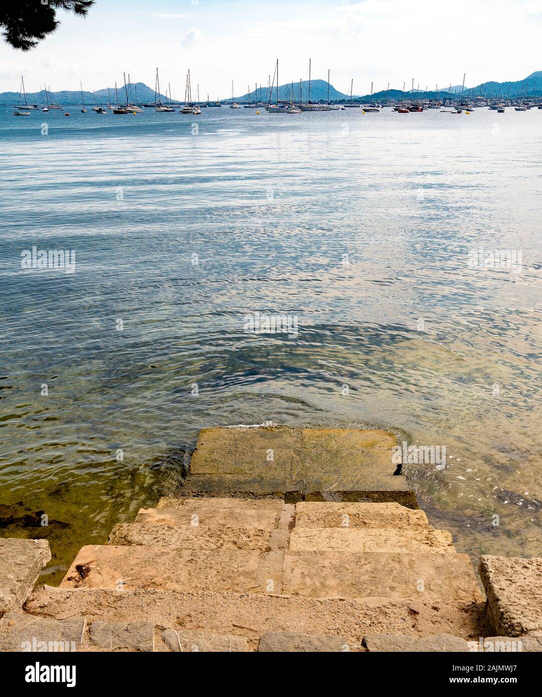 Stone stairs into the sea of a harbour Stock Photo - Alamy