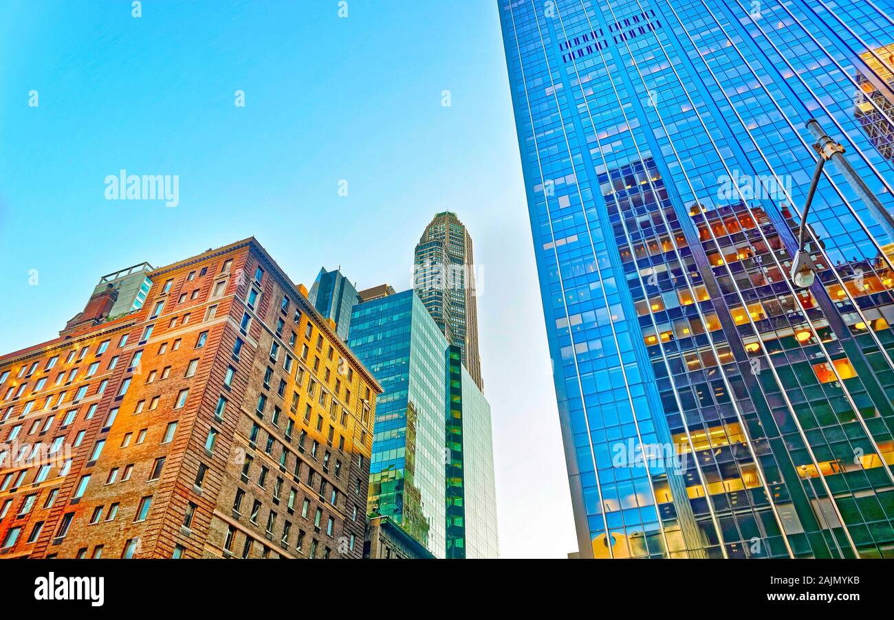 Bottom up view of Manhattan Skyscrapers reflex Stock Photo - Alamy