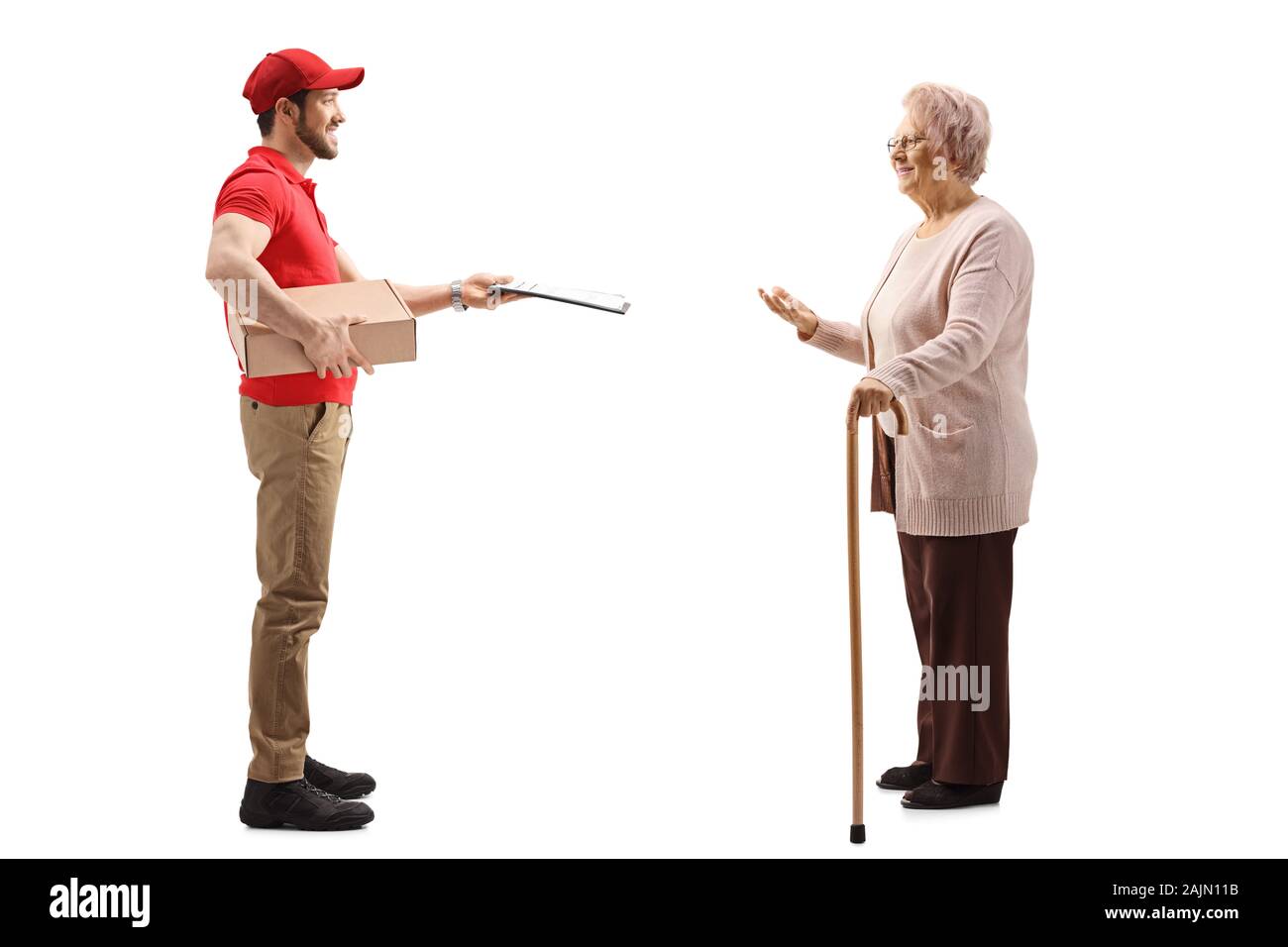 Full length profile shot of a delivery man handing over a package to a ...