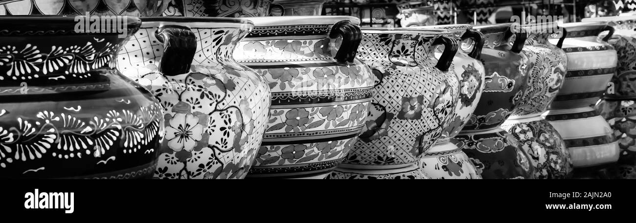 A panoramic format of a close up of black and white floral decorative ...