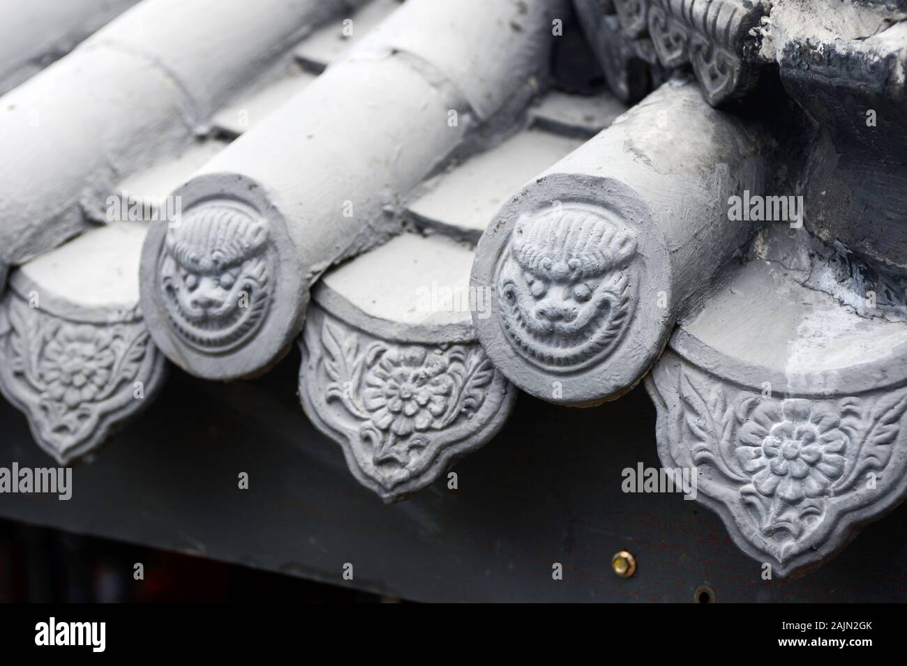 Chinese tile roof edge caps adorn a tile roof at the Badaling site of ...