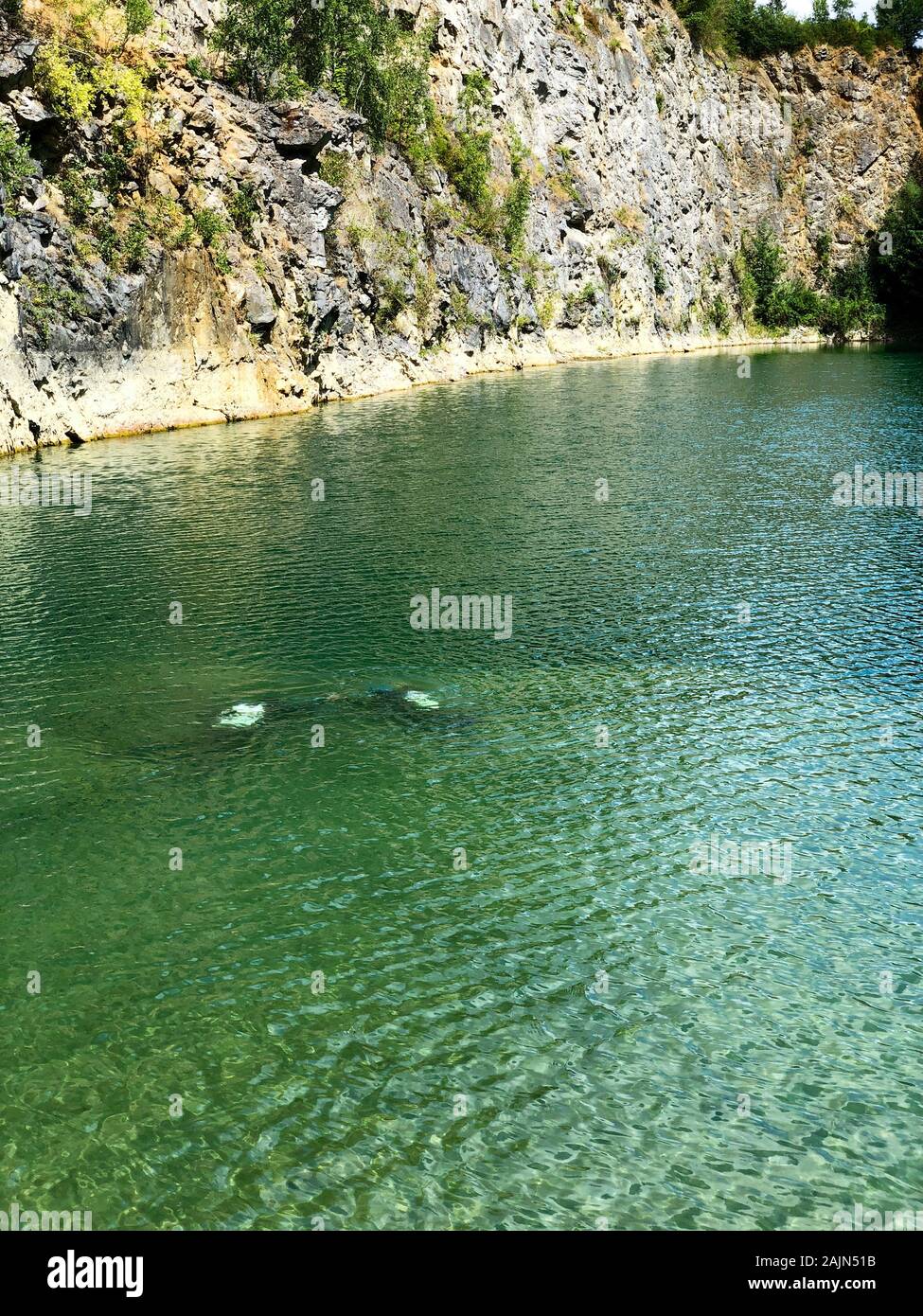 Quarry explored by scuba divers. Flooded quarry for adrenaline hobby ...
