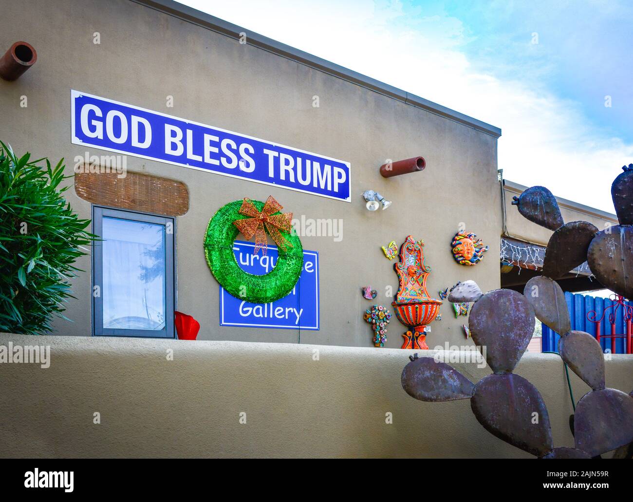 A Retail gift store and gallery displays a big outdoor banner declaring ...