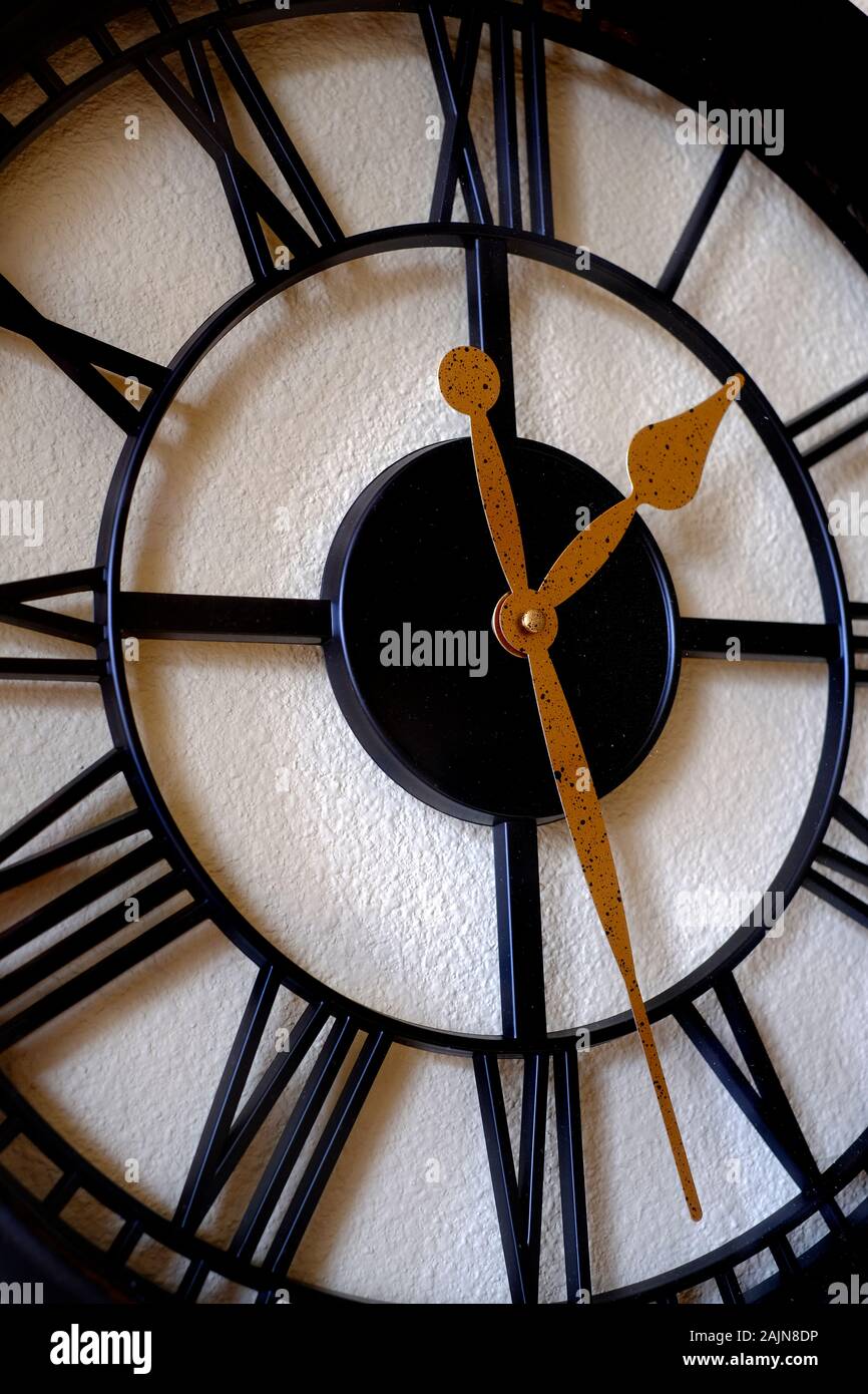 Clock on wall telling time reflection of passing of life Stock Photo ...