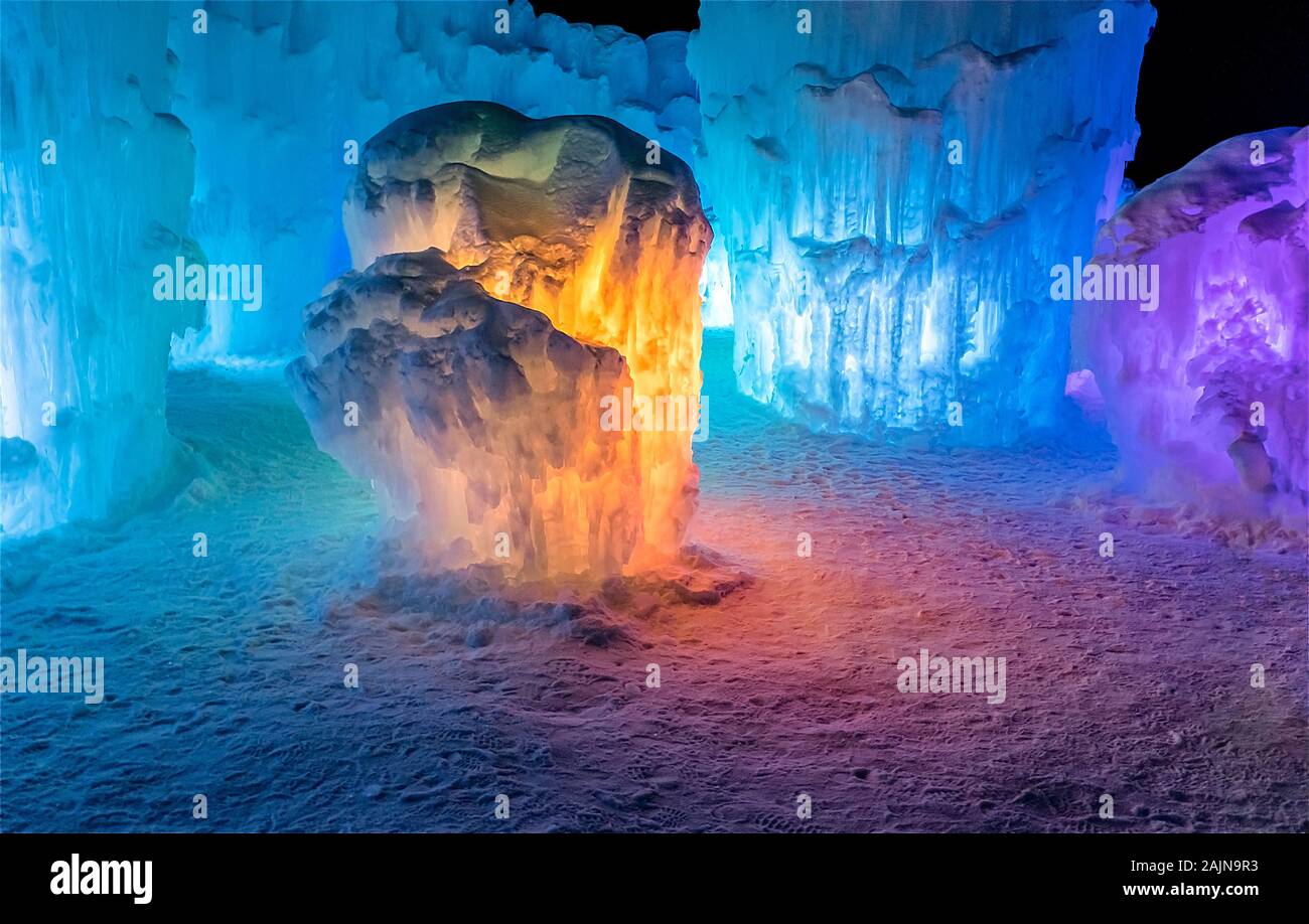 Colorful ice castle formations at night time Stock Photo - Alamy
