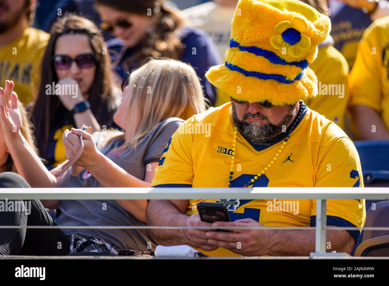 Orlando, Florida, USA. 1st Jan, 2020. A Michigan fan checking stats on ...