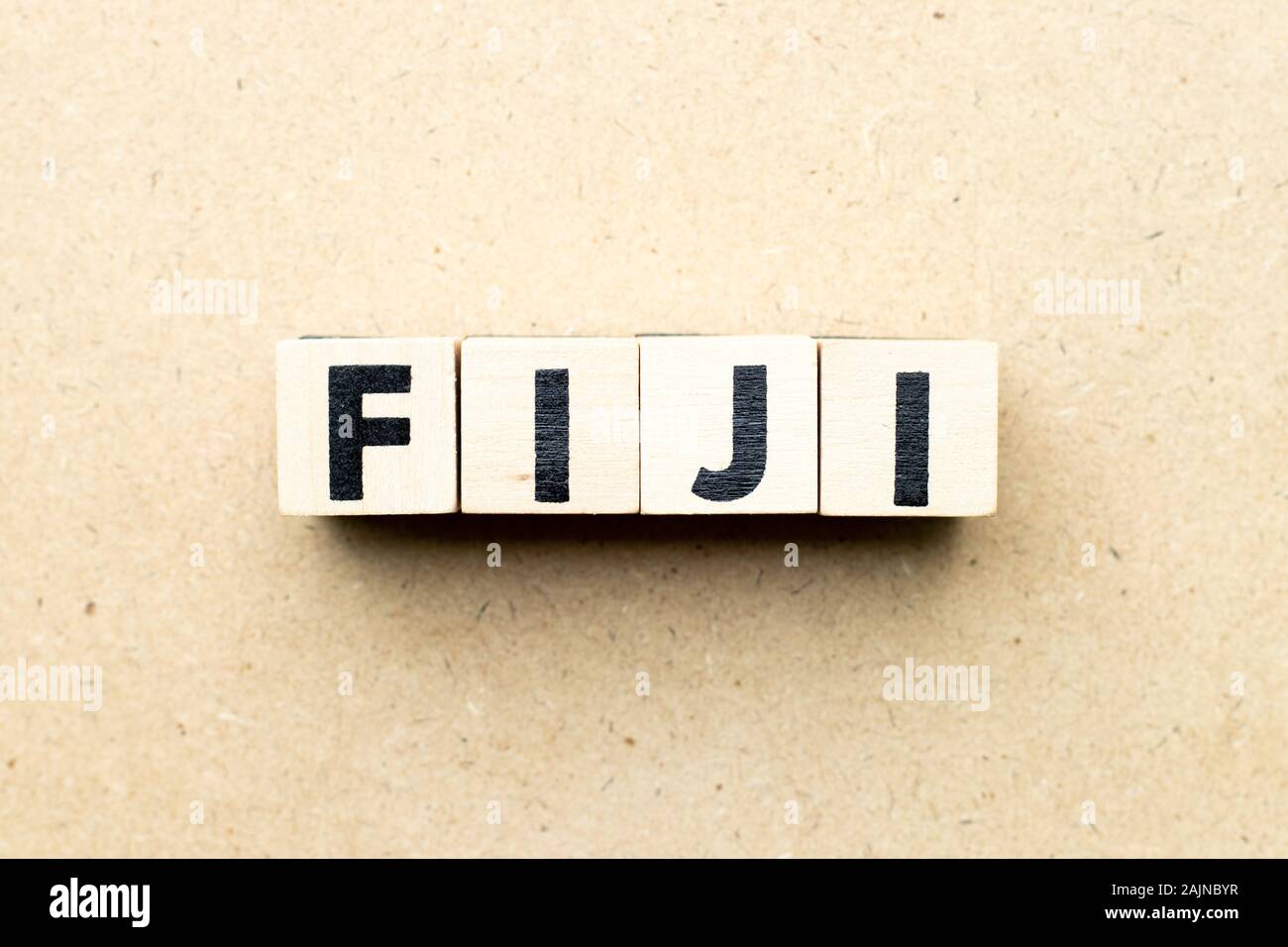 Letter block in word Fiji on wood background Stock Photo - Alamy