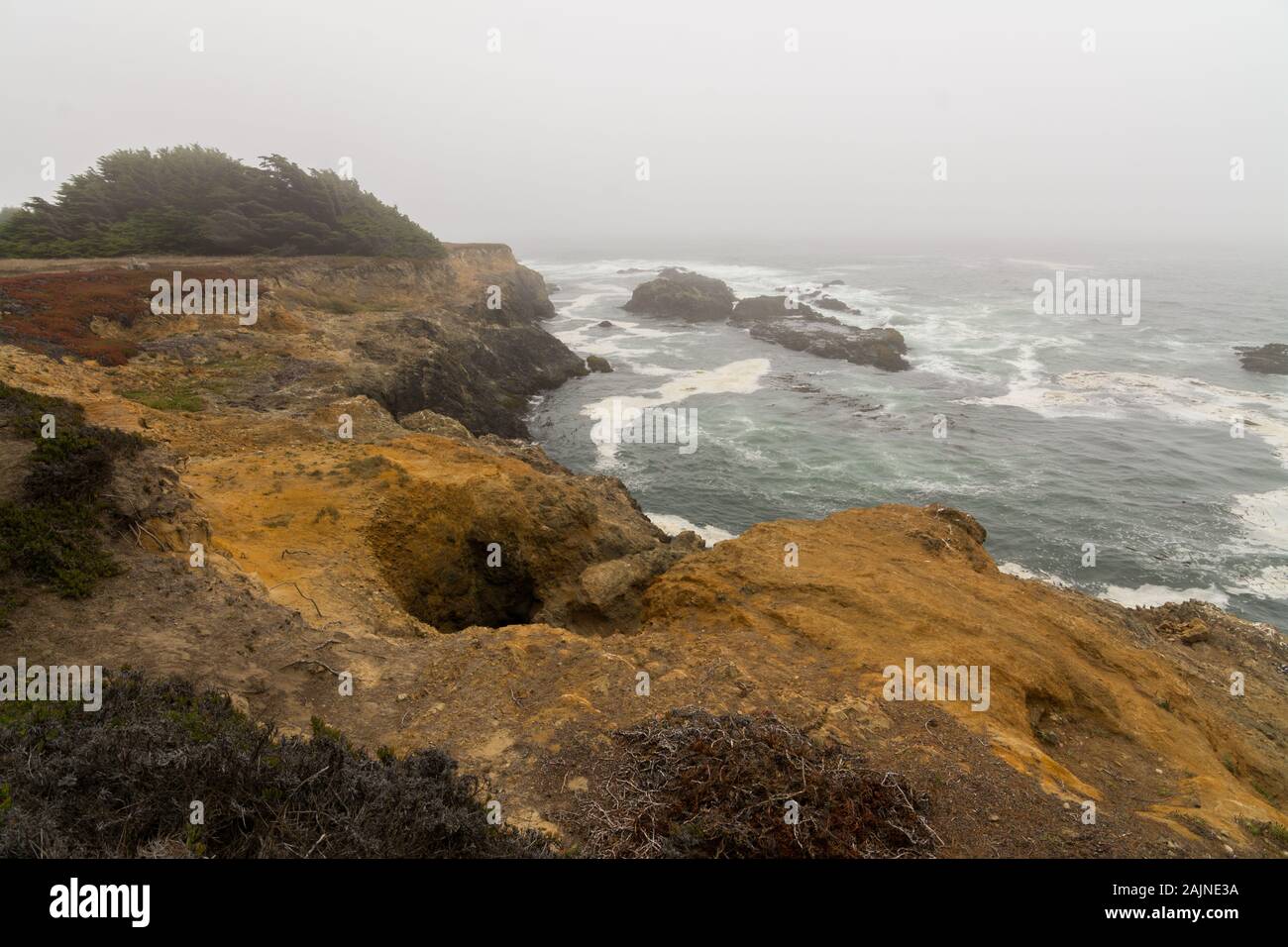 Ocean cliff coastal landscape storm and fog Stock Photo - Alamy