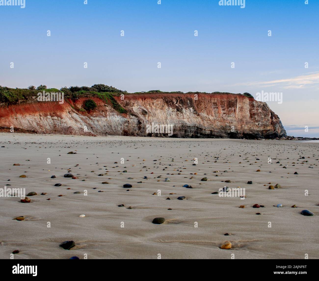 red rock cliffs on the beach Stock Photo - Alamy
