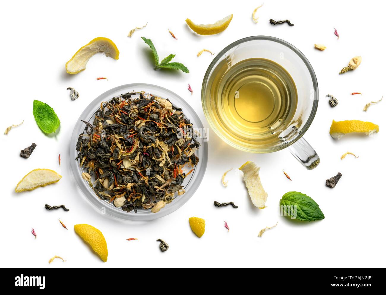 Green tea with natural aromatic additives and a cup. Top view on white ...