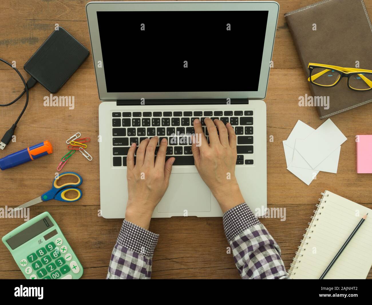 designer using laptop computer at home. view from top. free space for ...