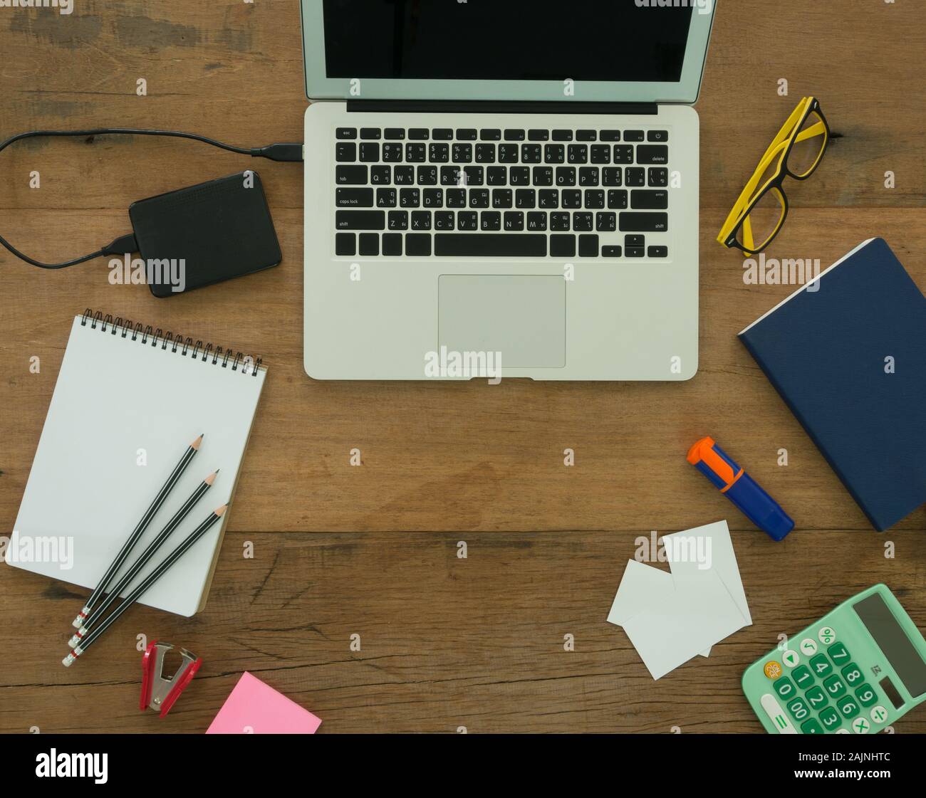 Equipment designer with stationary ,laptop computer on the desk. view ...