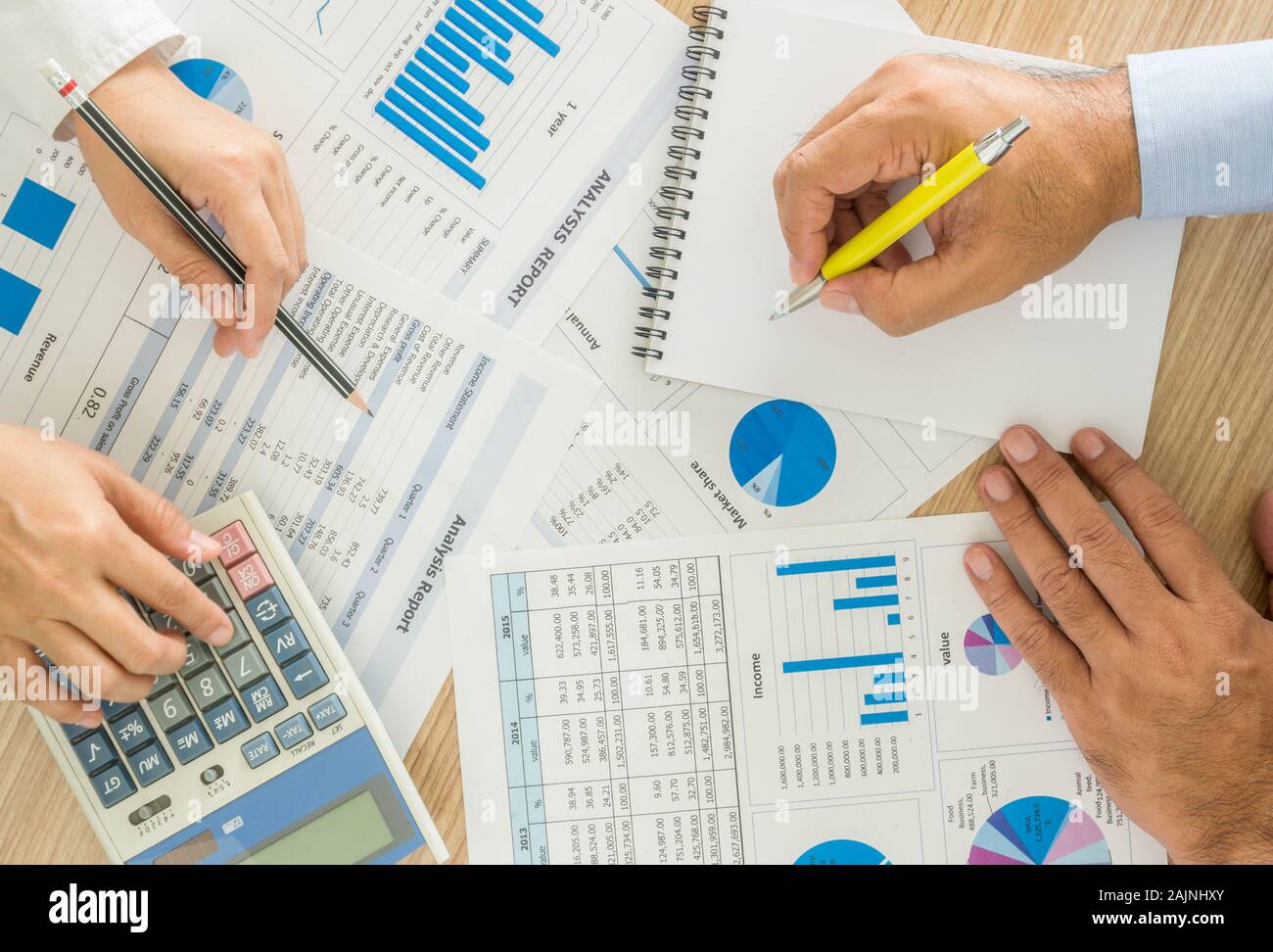 marketer worker analyzing statistical data on desk in office. top view ...