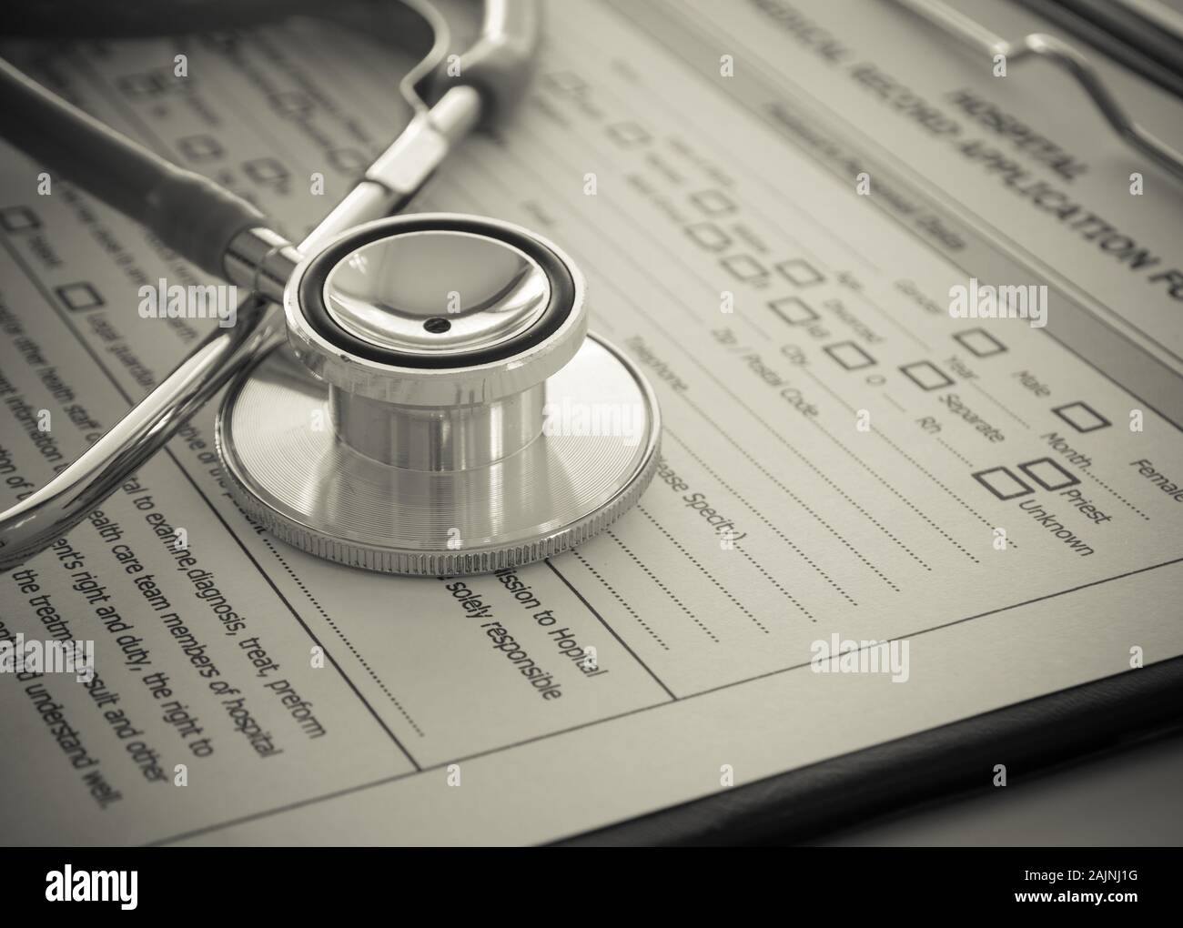 stethoscope with medical record application form on physicians desk ...