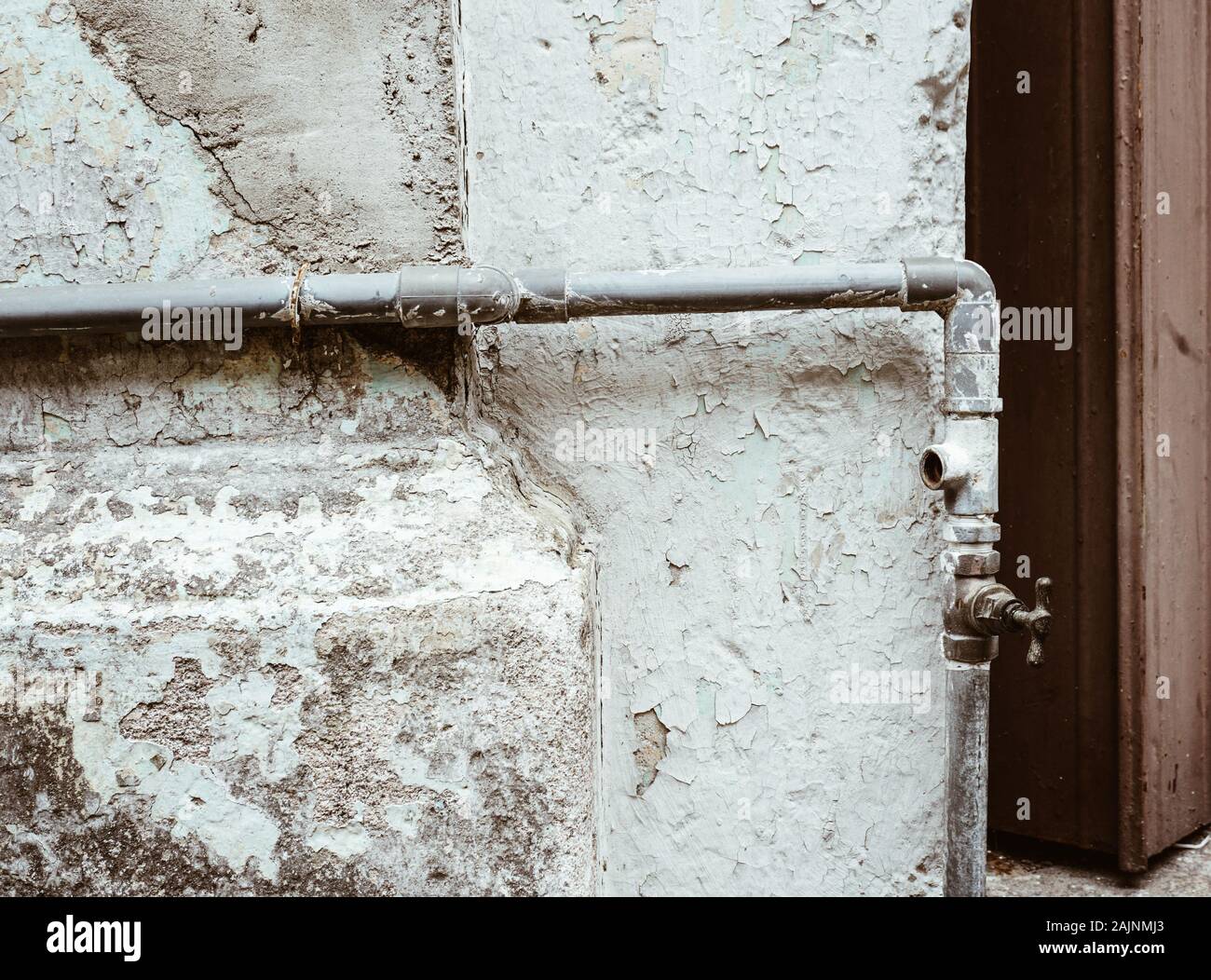 Brick wall with old faucet of ancient building in old town of Malacca ...