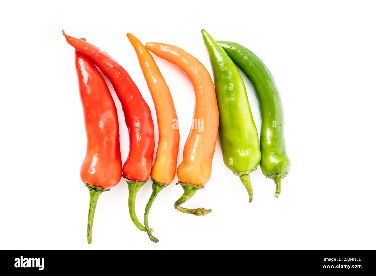 Red, green chilli peppers isolated on a white background Stock Photo ...