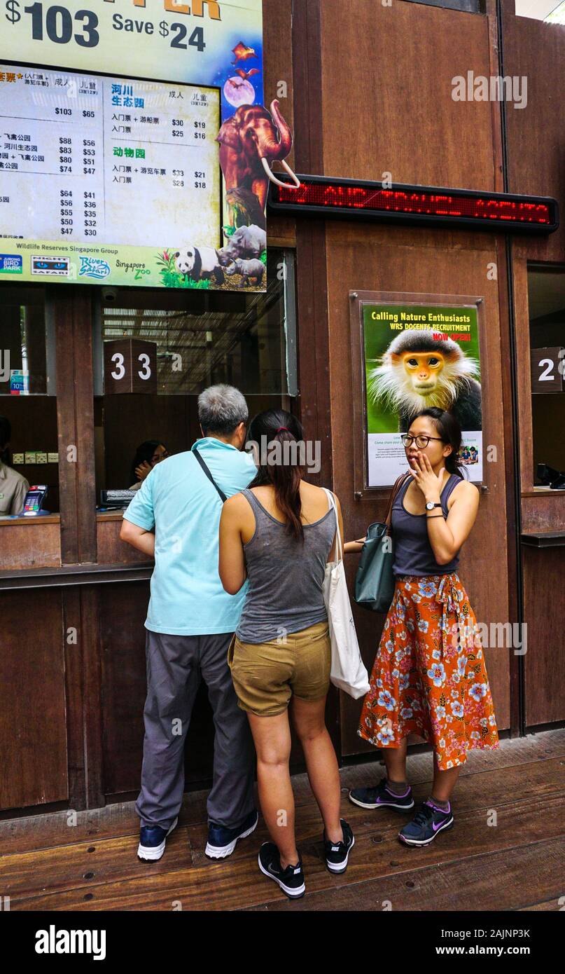 Singapore - Aug 17, 2014. People waiting at ticket booth of Singapore ...